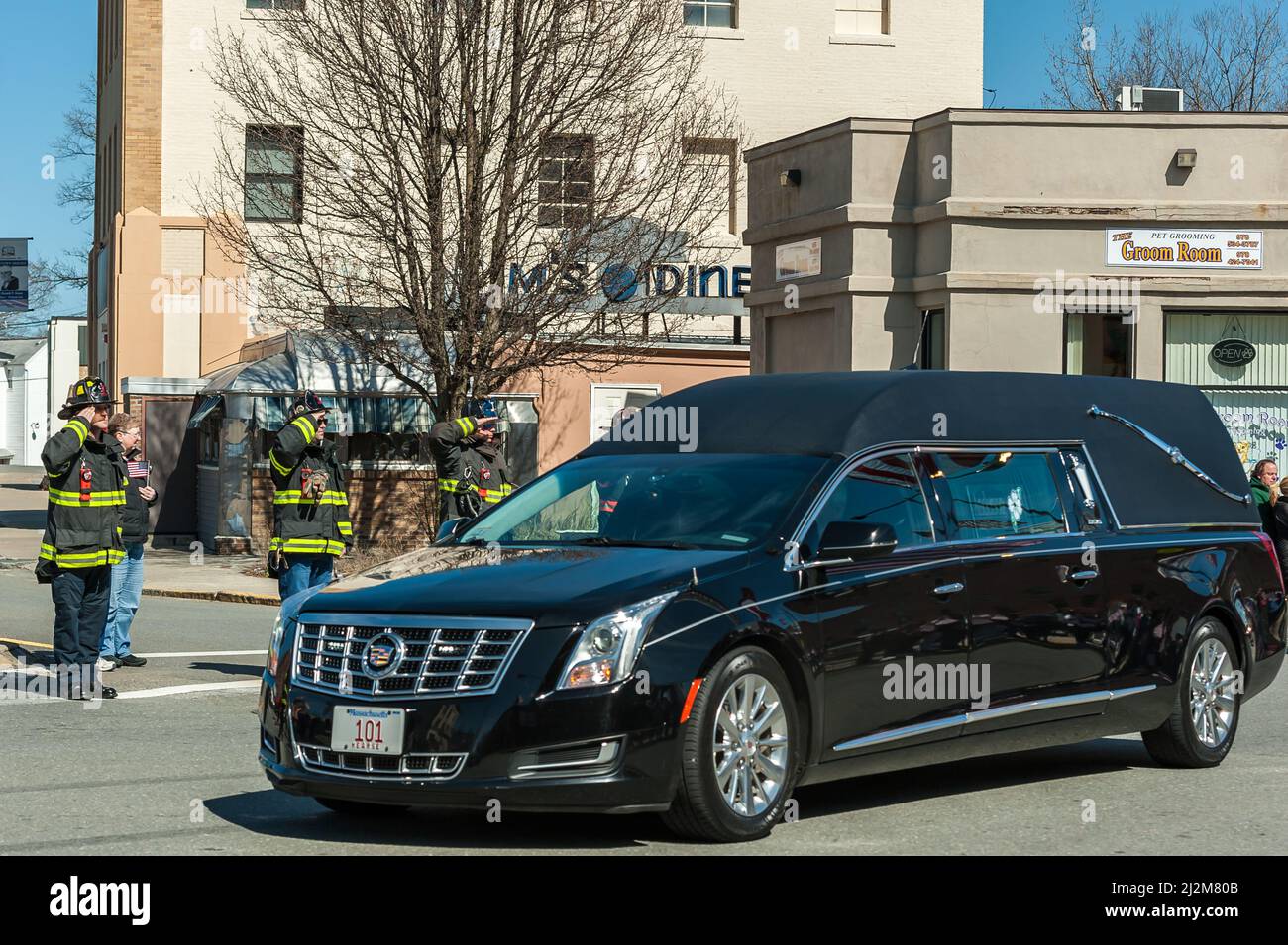 Leominster firefighters saluting hearse at procession for fallen USMC ...