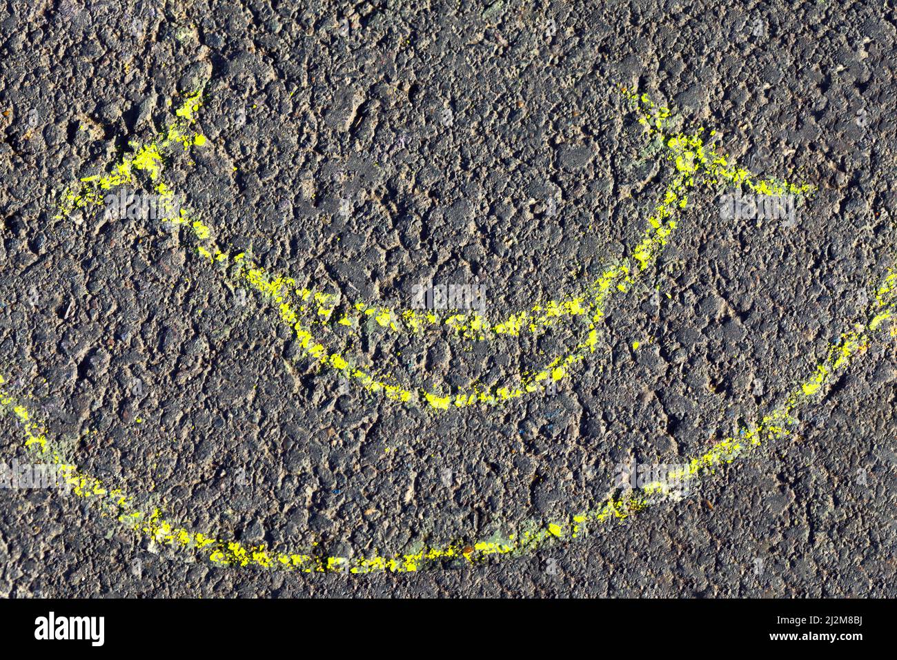 Smile drawn with chalk on the pavement Stock Photo - Alamy