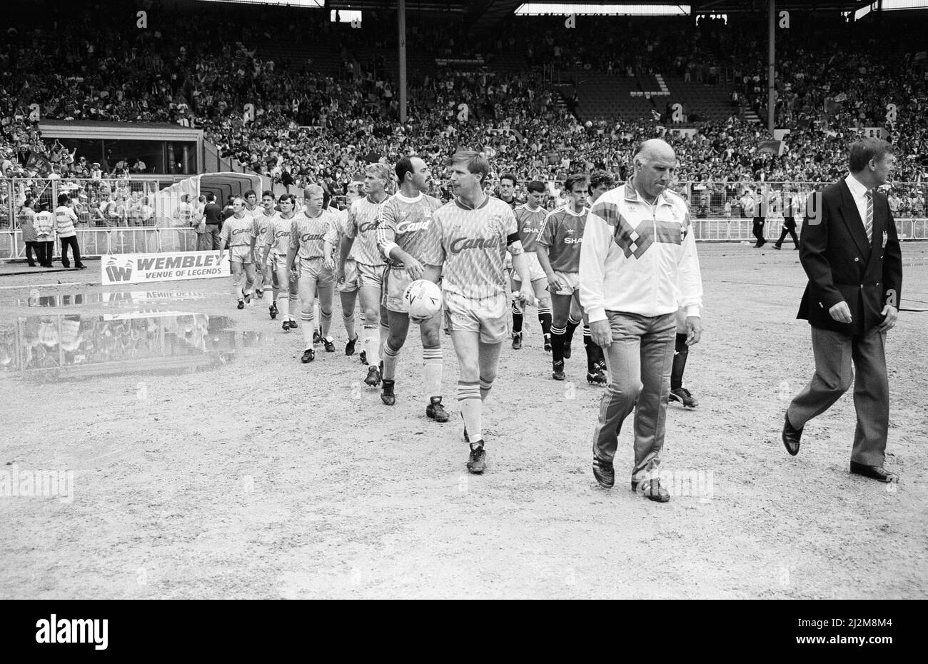 Liverpool coach Ronnie Moran walks out on to the pitch at Wembley as he ...