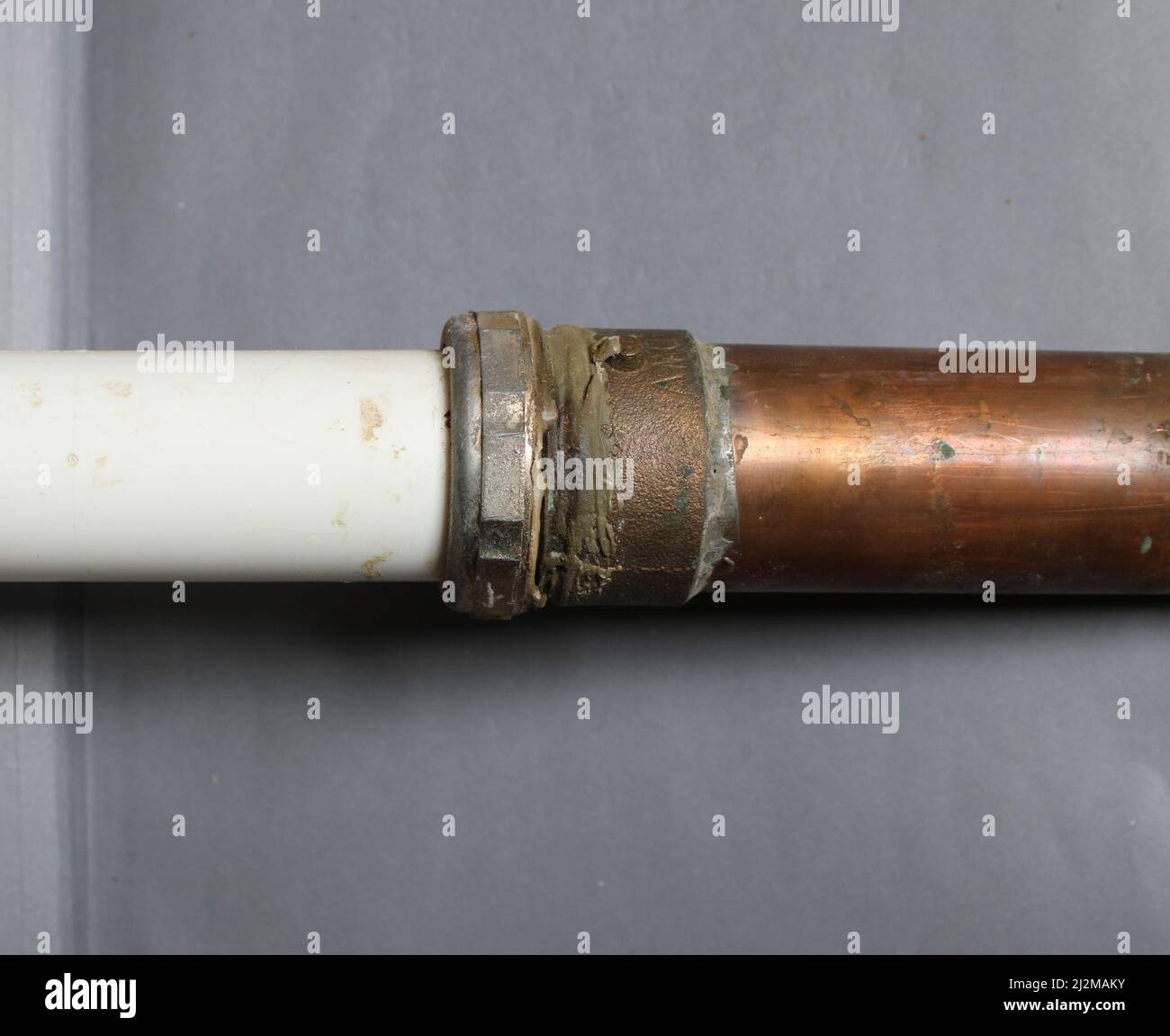 The Junction of a Plastic and Copper Drain Pipe Stock Photo - Alamy