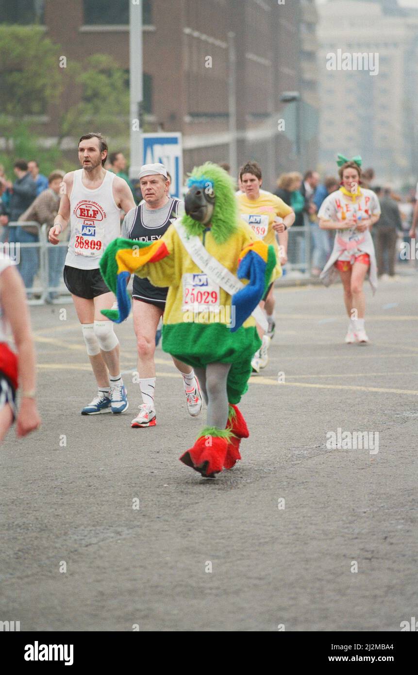 The London Marathon - 1990Runners pass through and around the Tower ...