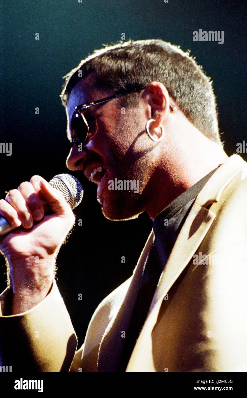George Michael performing on stage at the Wembley Arena during his ...