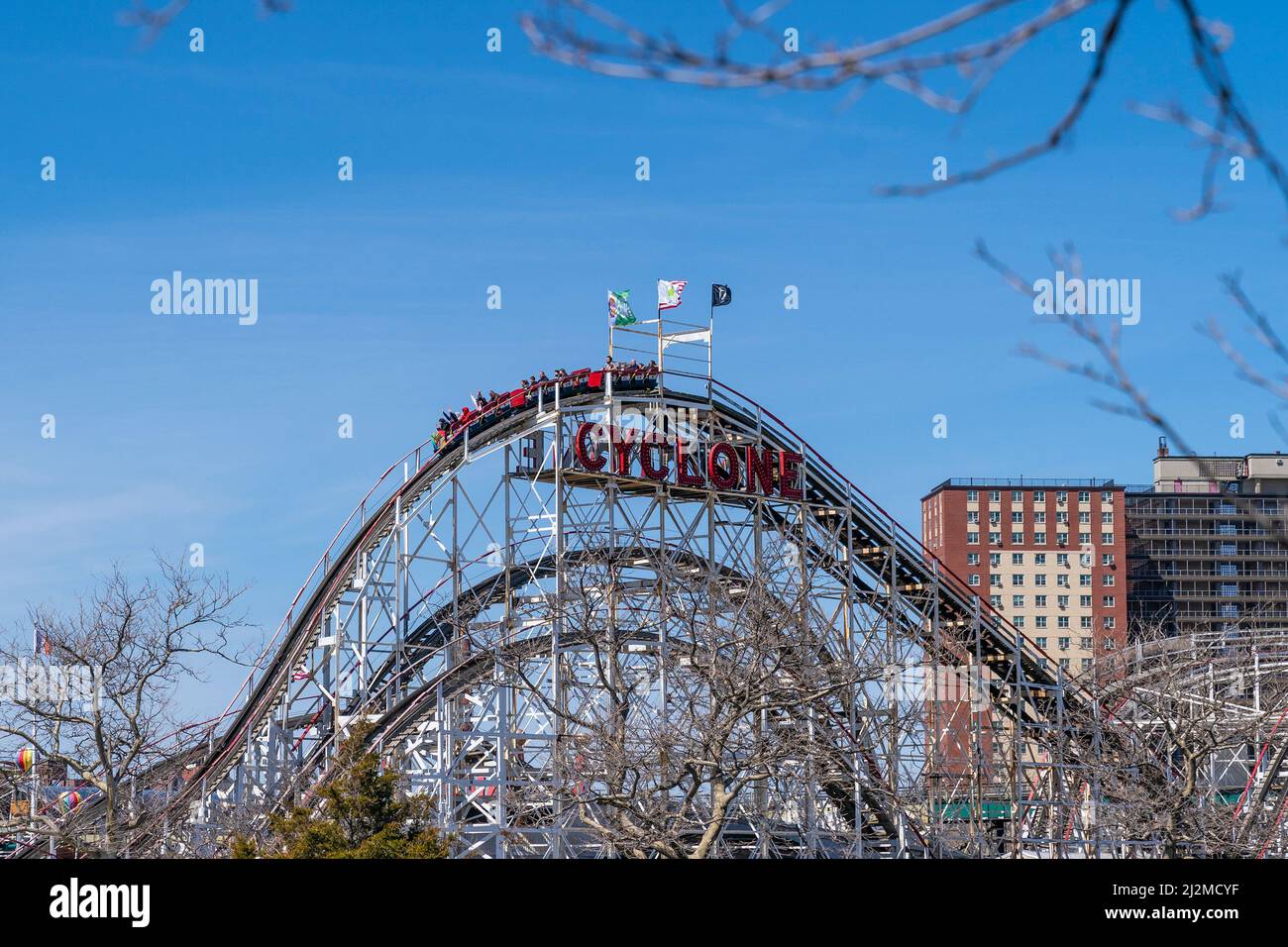 Visitors ride Coney Island Cyclone roller coaster during season opening ...