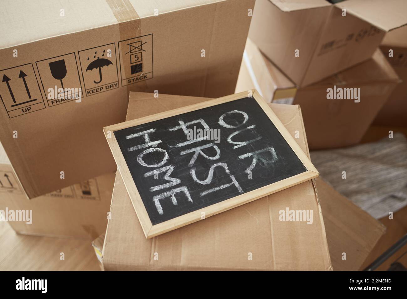 Its our first home. Shot of a blackboard with the words OUR FIRST HOME ...