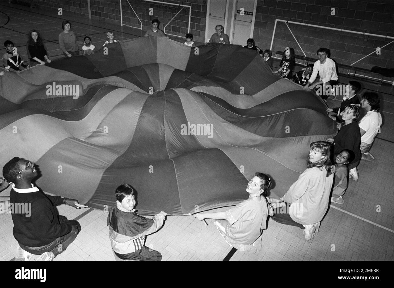 Children playing parachute games in hi-res stock photography and images ...