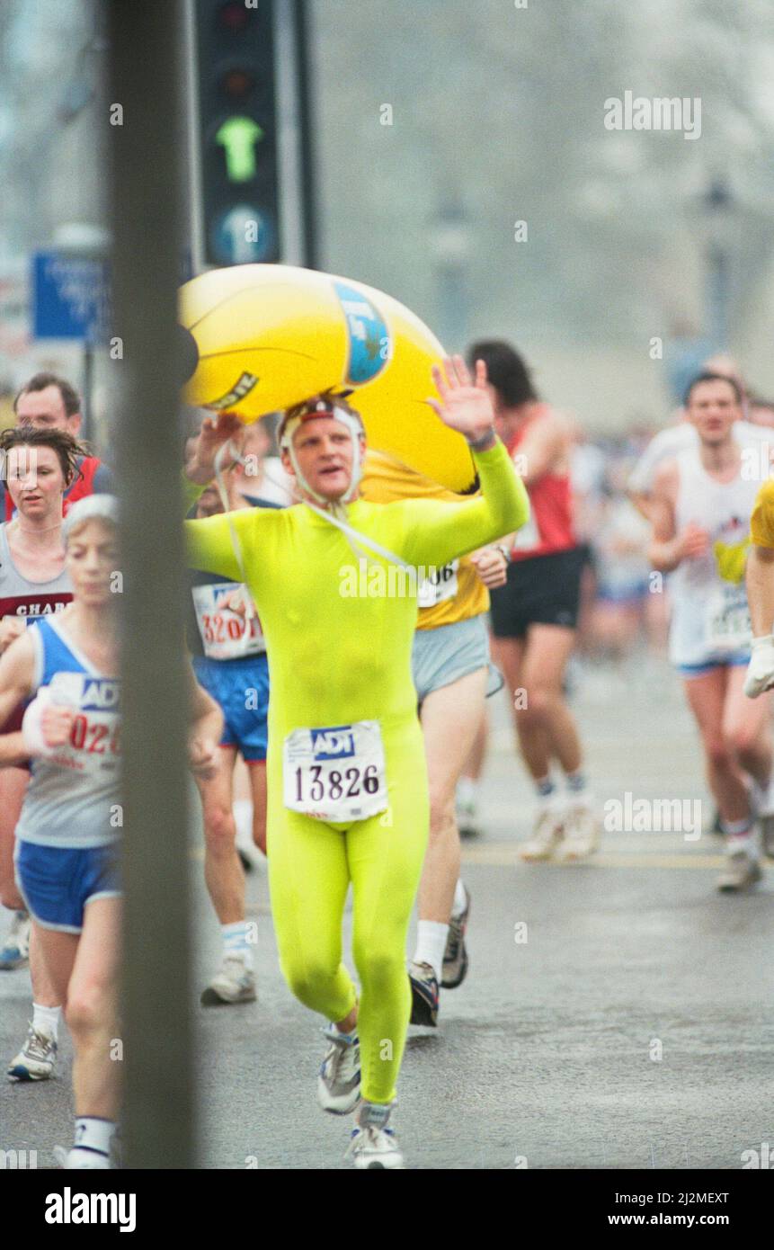 The London Marathon - 1990Runners pass through and around the Tower ...