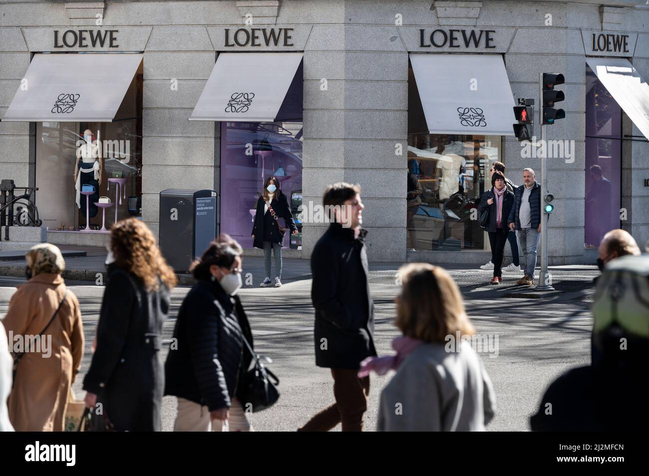 Pedestrians walk are seen in front of the Spanish luxury clothing and ...