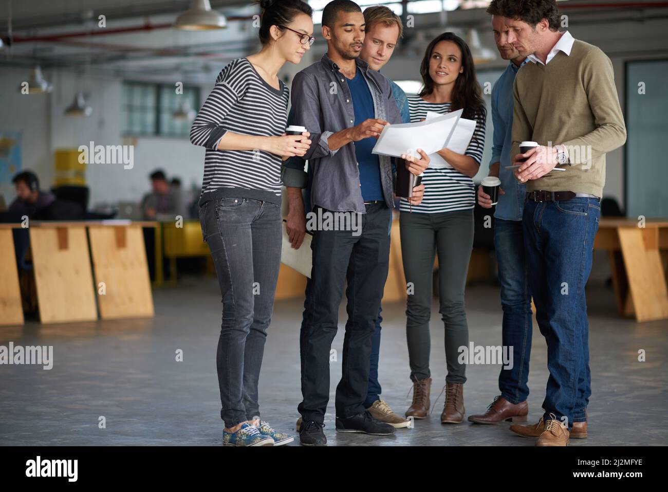 Checking the stats together. Full length shot of a group of staff ...