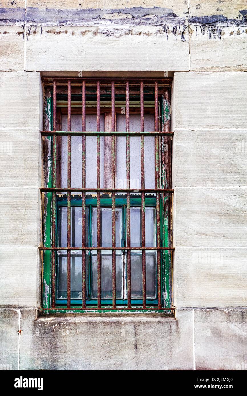 Old glass window behind bars of a prison building Stock Photo - Alamy