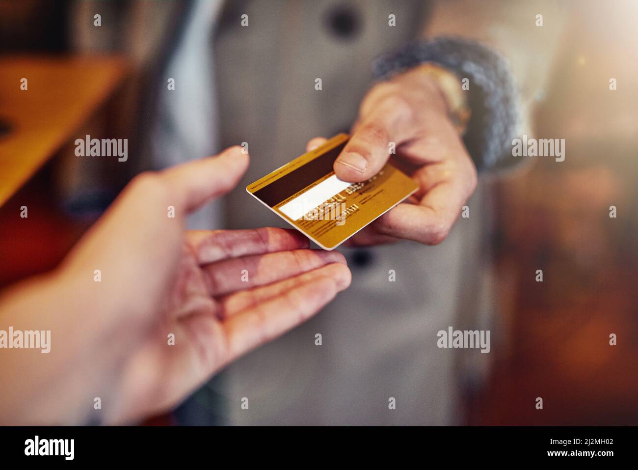 Ill put it on my card. Cropped shot of an unrecognizable young man ...