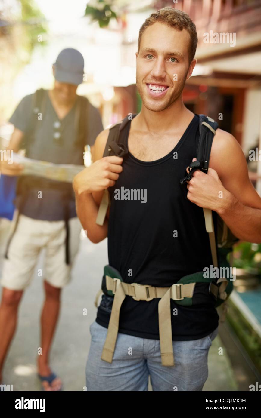 Have backpack will travel. Portrait of two smiling young friends ...