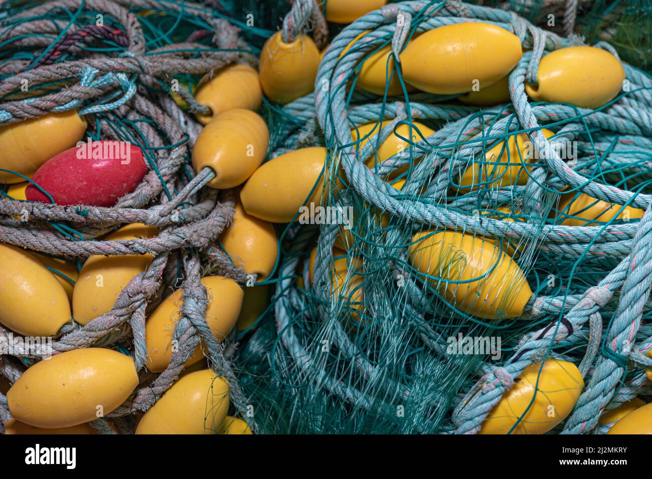 Green mesh background and yellow float, contrast in fishing Stock Photo ...