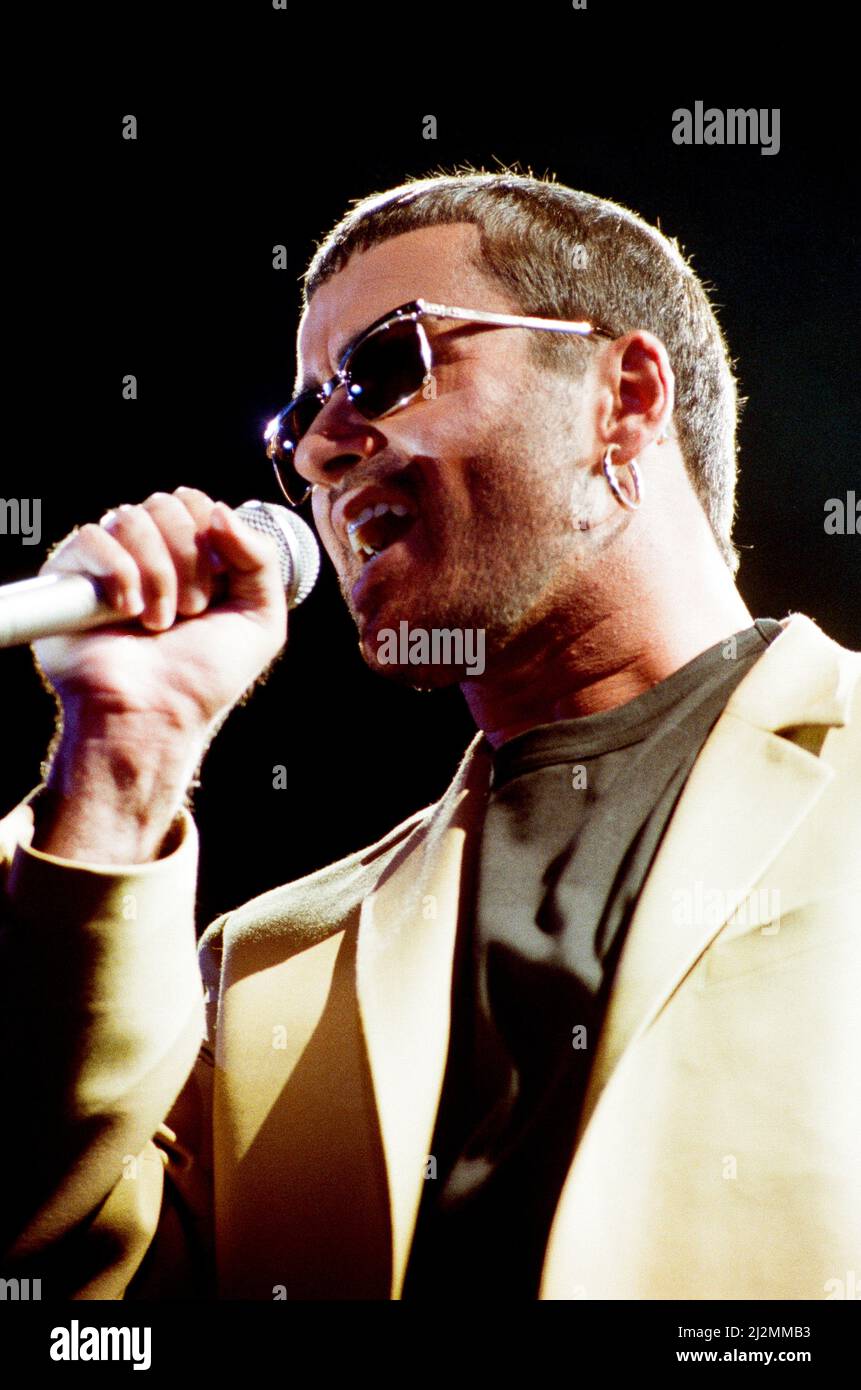 George Michael performing on stage at the Wembley Arena during his ...