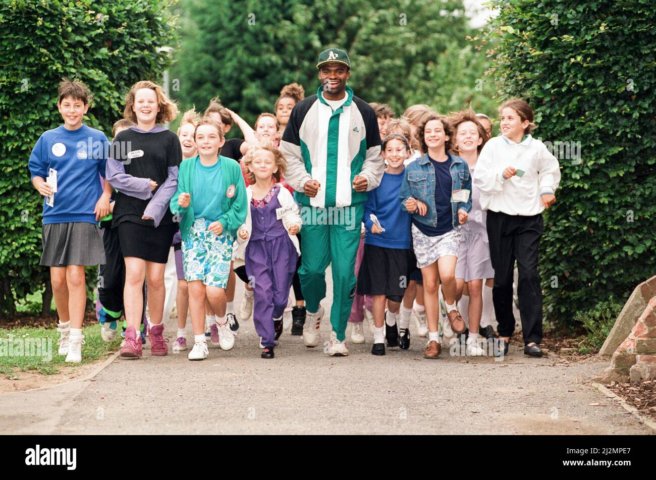 Kriss Akabusi at Geoffrey Field School, Reading. 8th July 1991 Stock ...