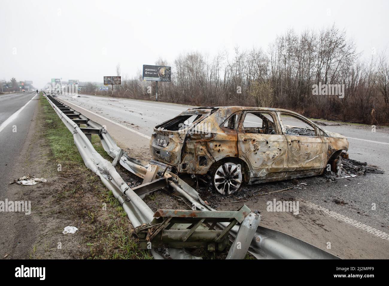 Bucha, Ukraine. 02nd Apr, 2022. A destroyed car seen on a highway 20km ...
