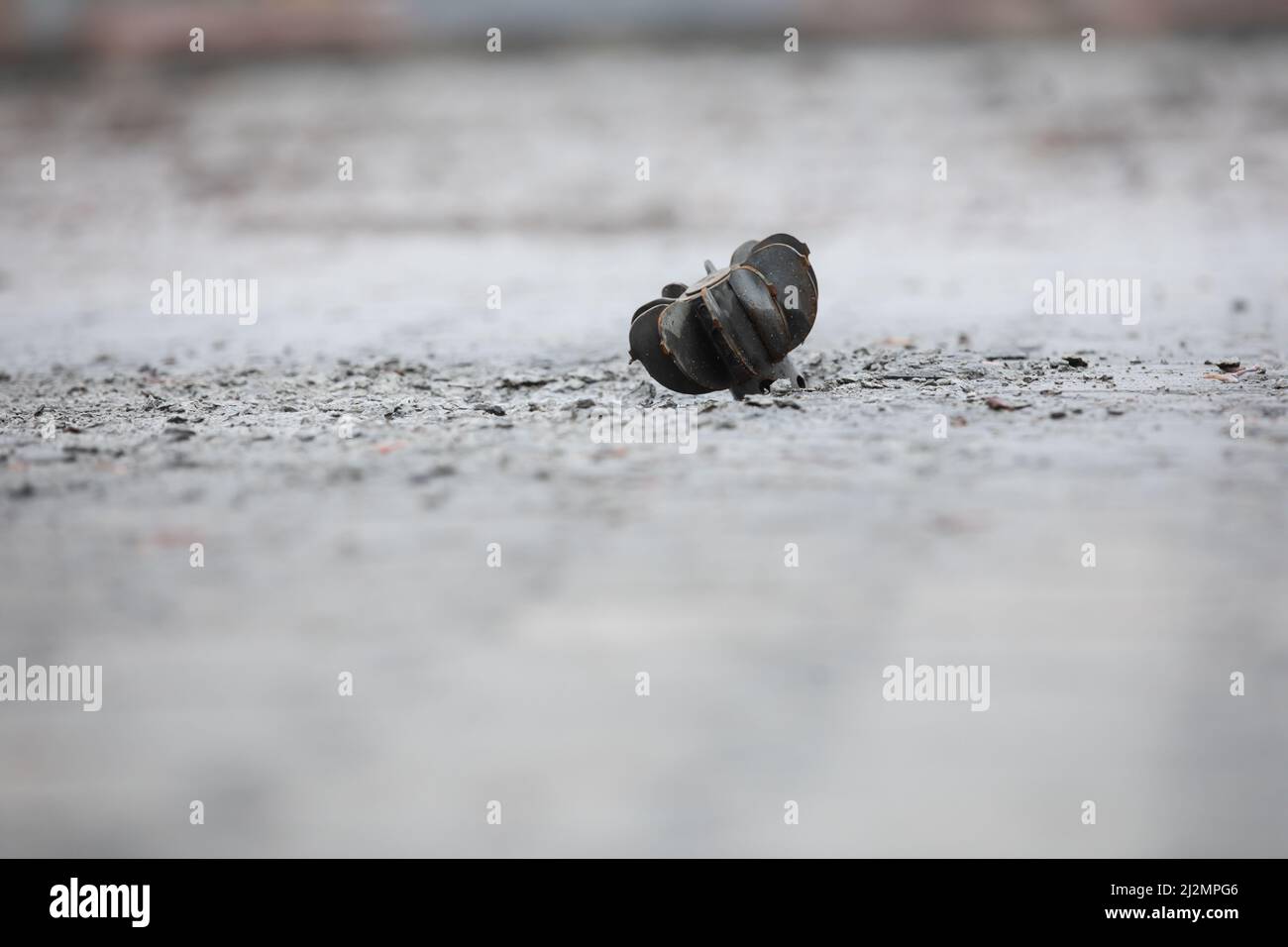 Bucha, Ukraine. 02nd Apr, 2022. Unexploded mine in the asphalt in the ...