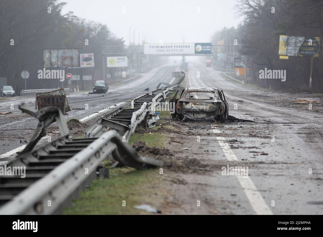Bucha, Ukraine. 02nd Apr, 2022. A destroyed car seen on a highway 20km ...