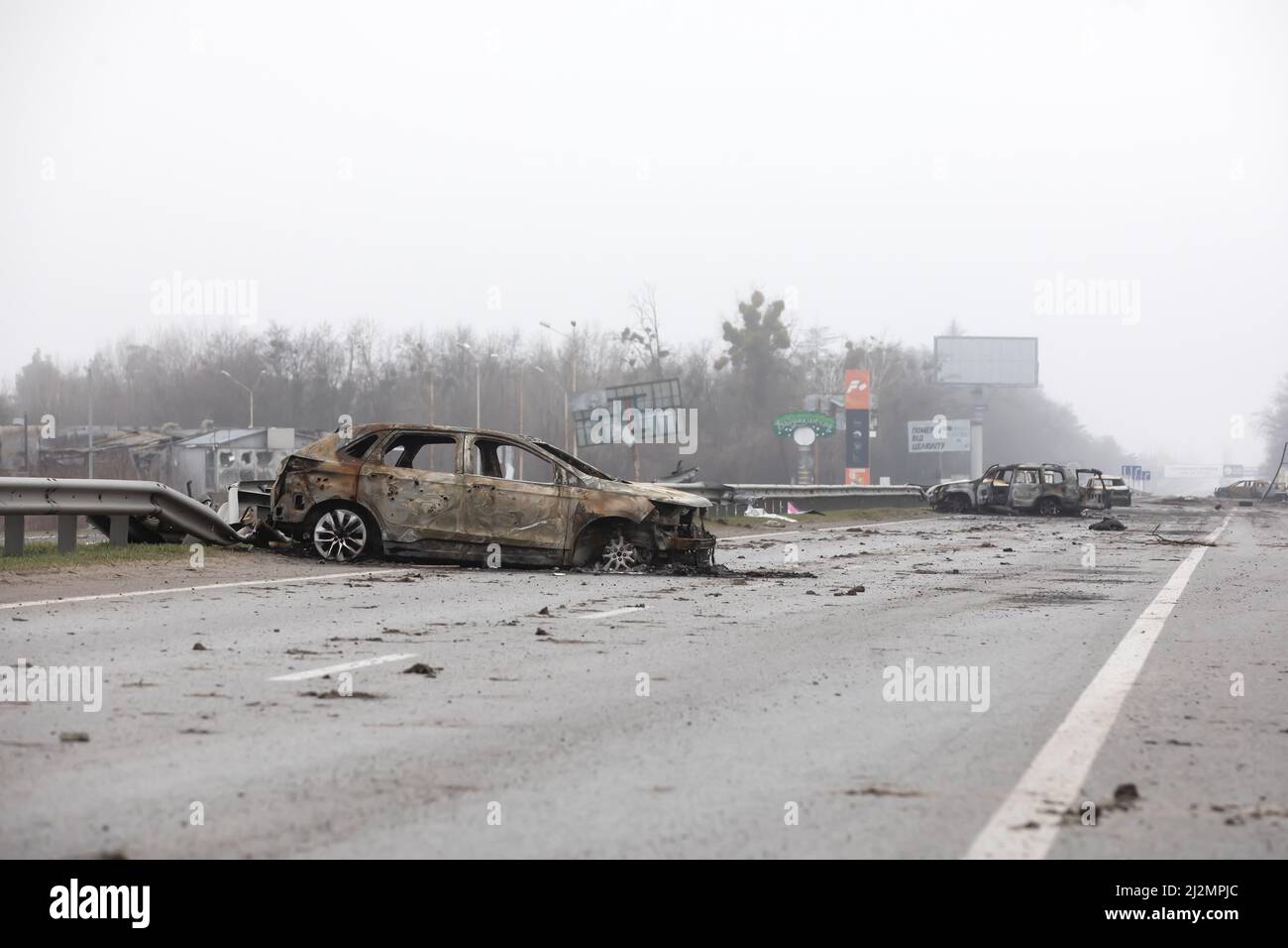 Bucha, Ukraine. 02nd Apr, 2022. A destroyed car seen on a highway 20km ...