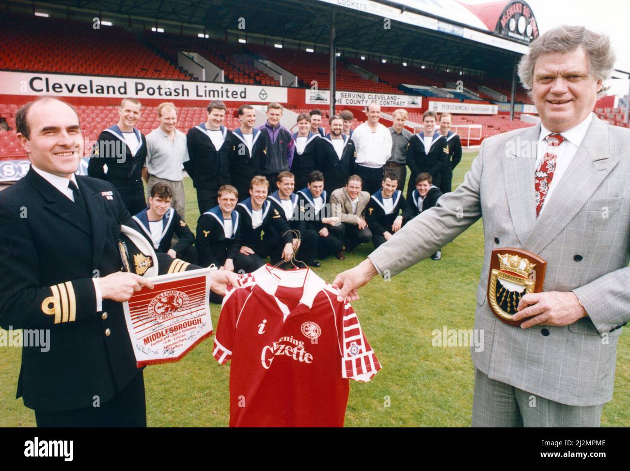 Middlesbrough's chairman, Colin Henderson, presents a set of shirts and ...
