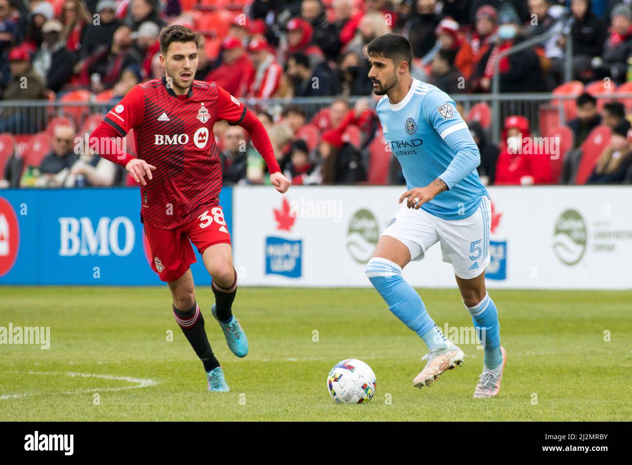 Luca Petrasso (38) and Thiago Martins (5) in action during the MLS game ...