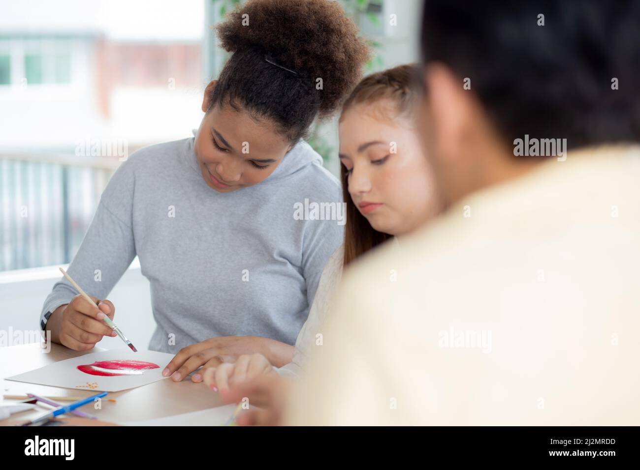 Group of student sitting and studying and learning drawing with teacher ...