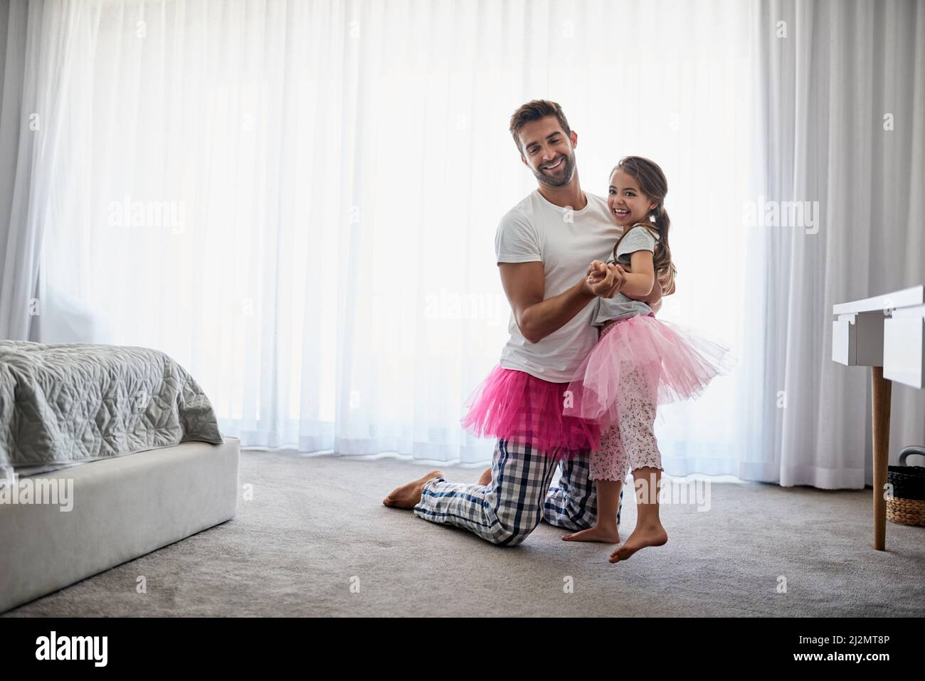 Leading her on a merry little dance. Full length shot of a handsome ...