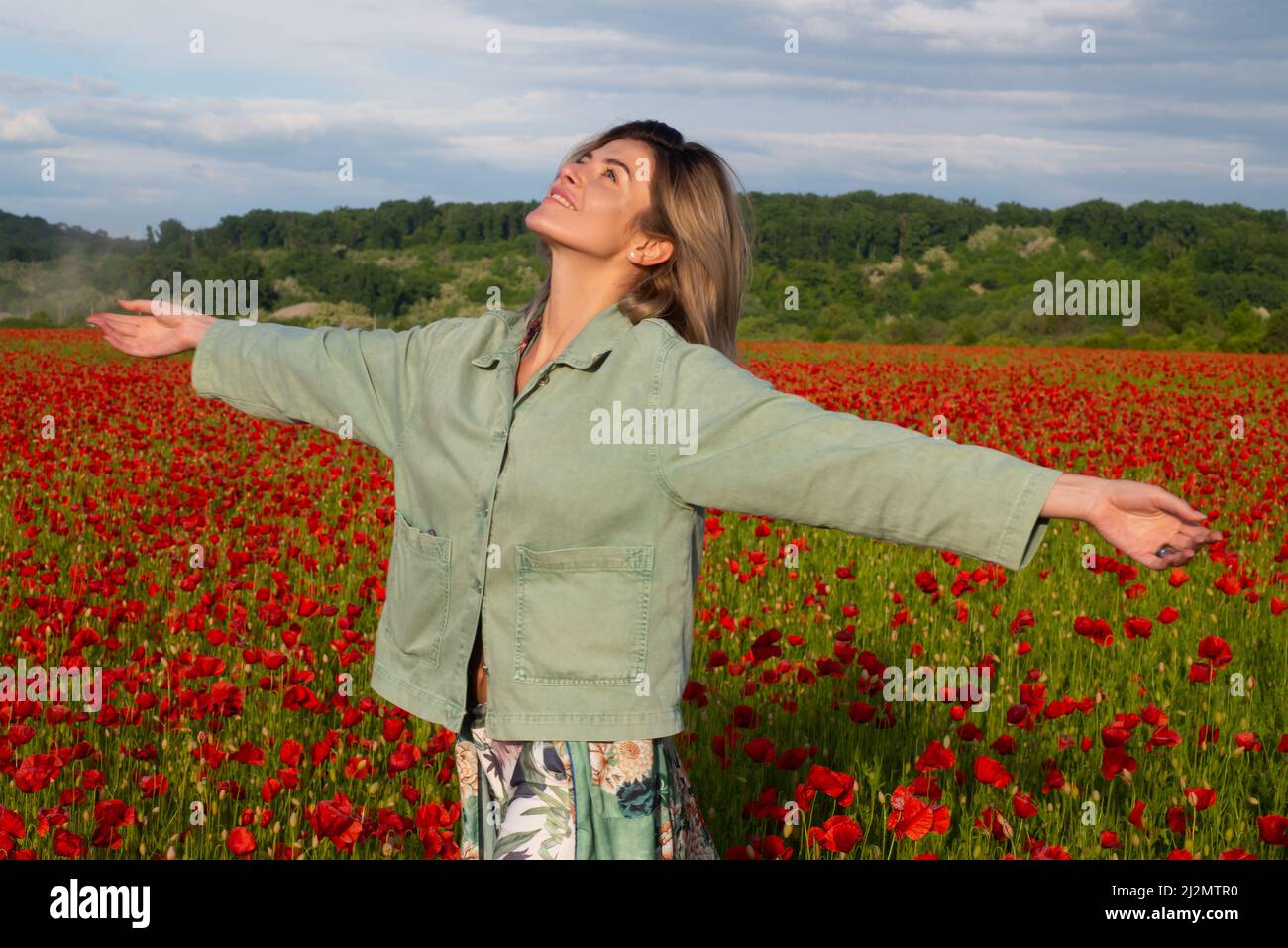 Beautiful young woman in poppy field. Young woman outdoor in poppy ...