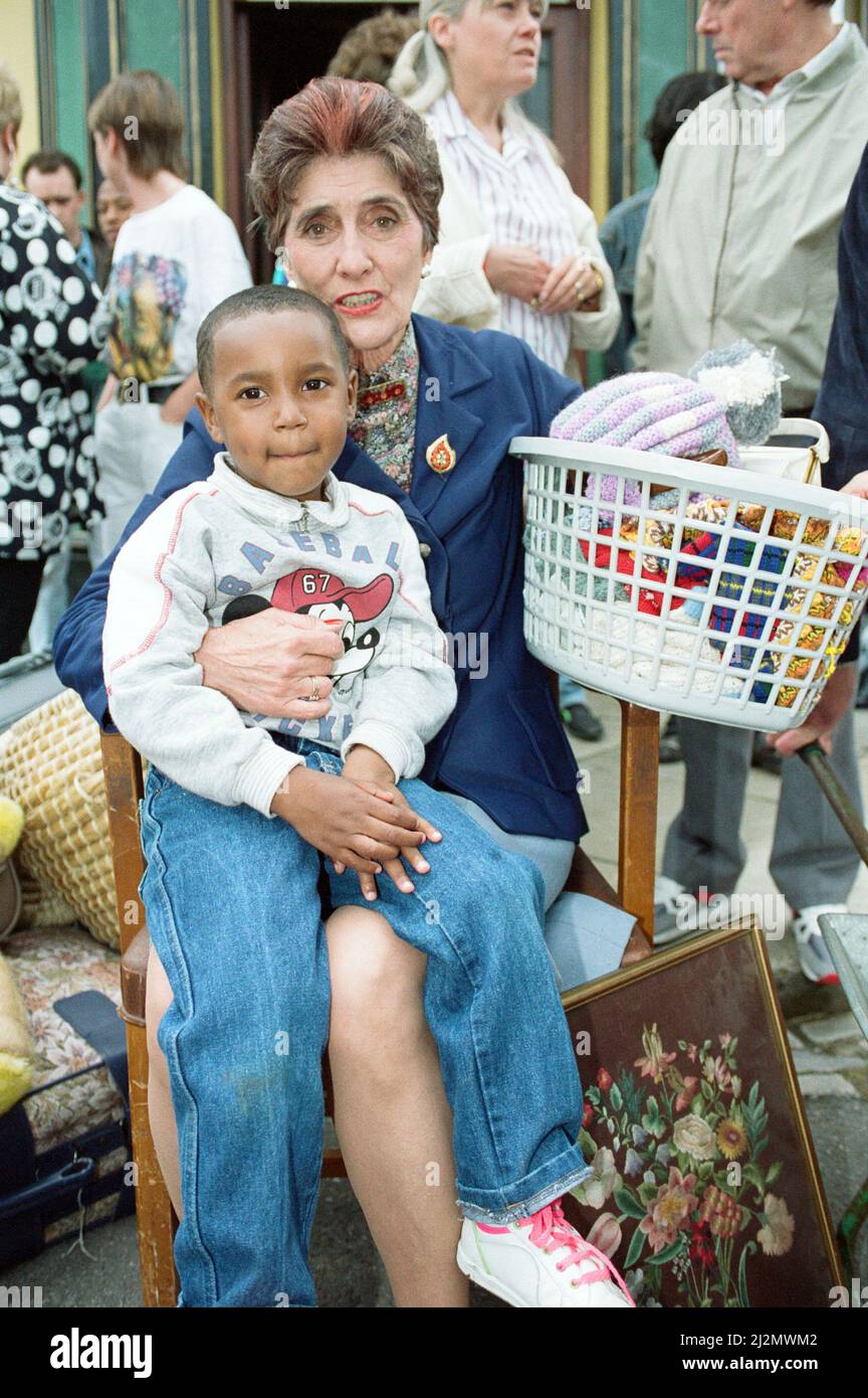 The cast of EastEnders on set. June Brown as Dot Cotton with a young ...