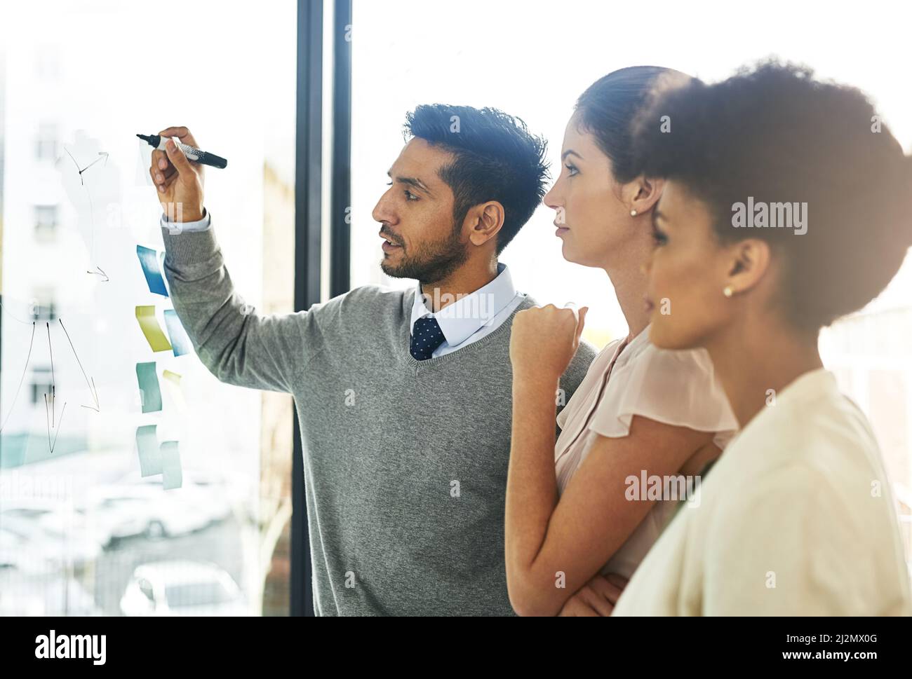 Theyve perfected the art of brainstorming. Shot of a group of young ...