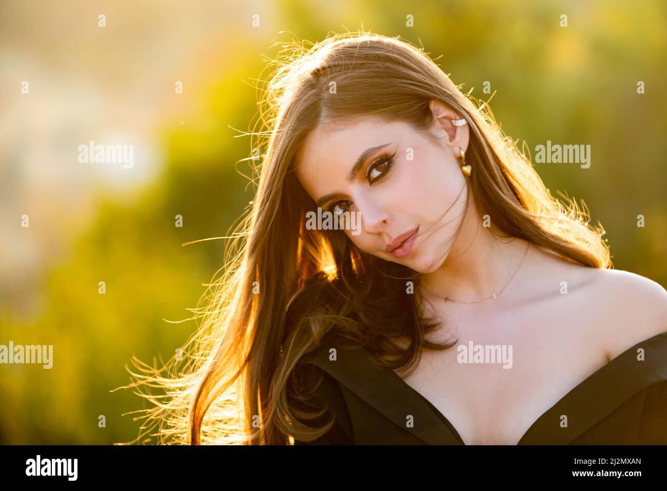 Portrait of beautiful young woman. Outdoor portrait of a cute girl ...