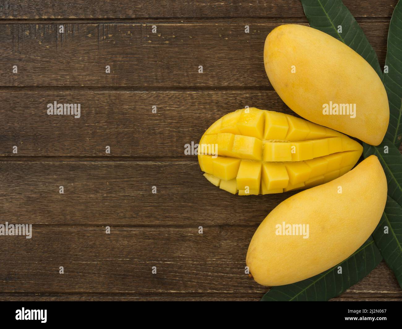 Fresh mango put on the wood table Stock Photo - Alamy