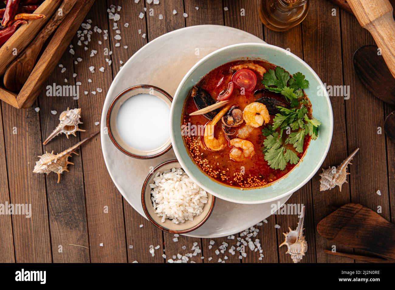 Bowl of thai seafood tom yam soup with rice Stock Photo - Alamy