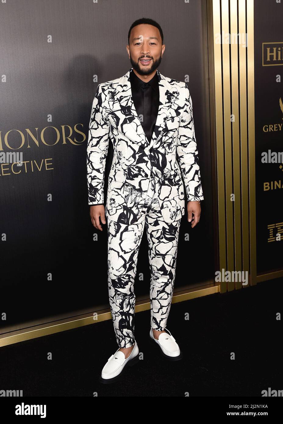 John Legend walking on the red carpet at the Recording Academy Honors ...