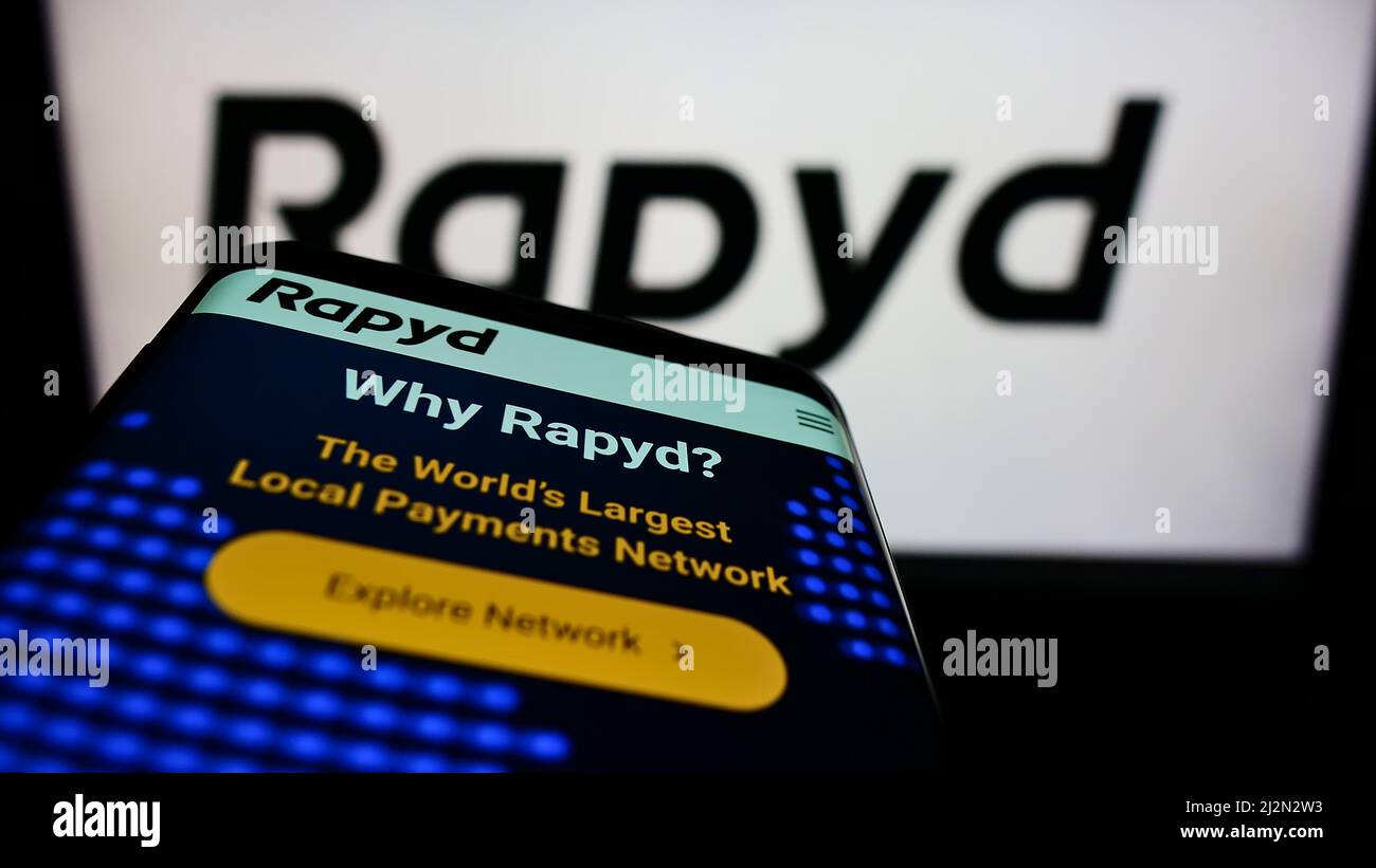 Smartphone with website of British fintech company Rapyd Financial ...