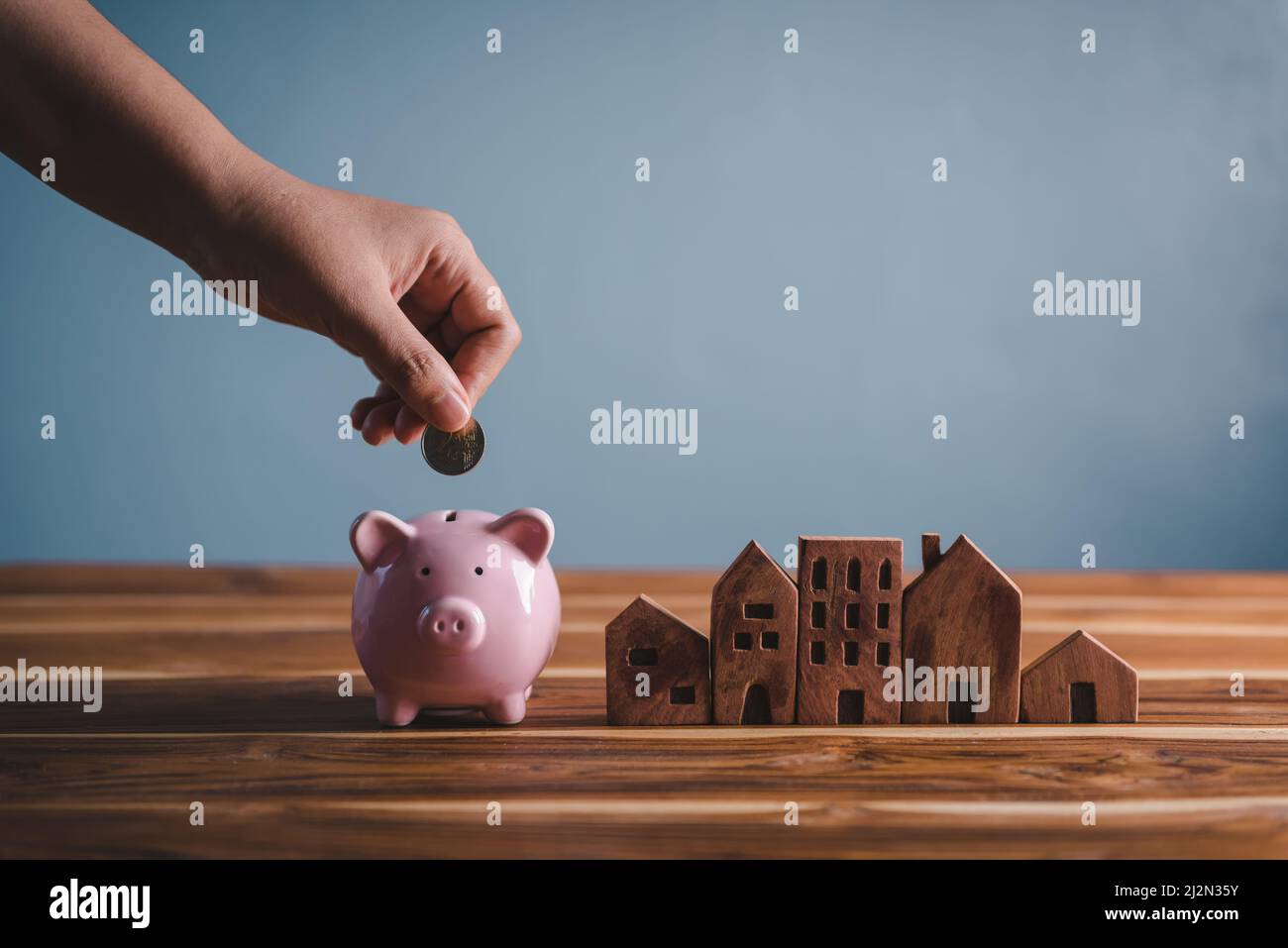 Money Savings for Future Property House Concept, Hand is Putting Coin ...