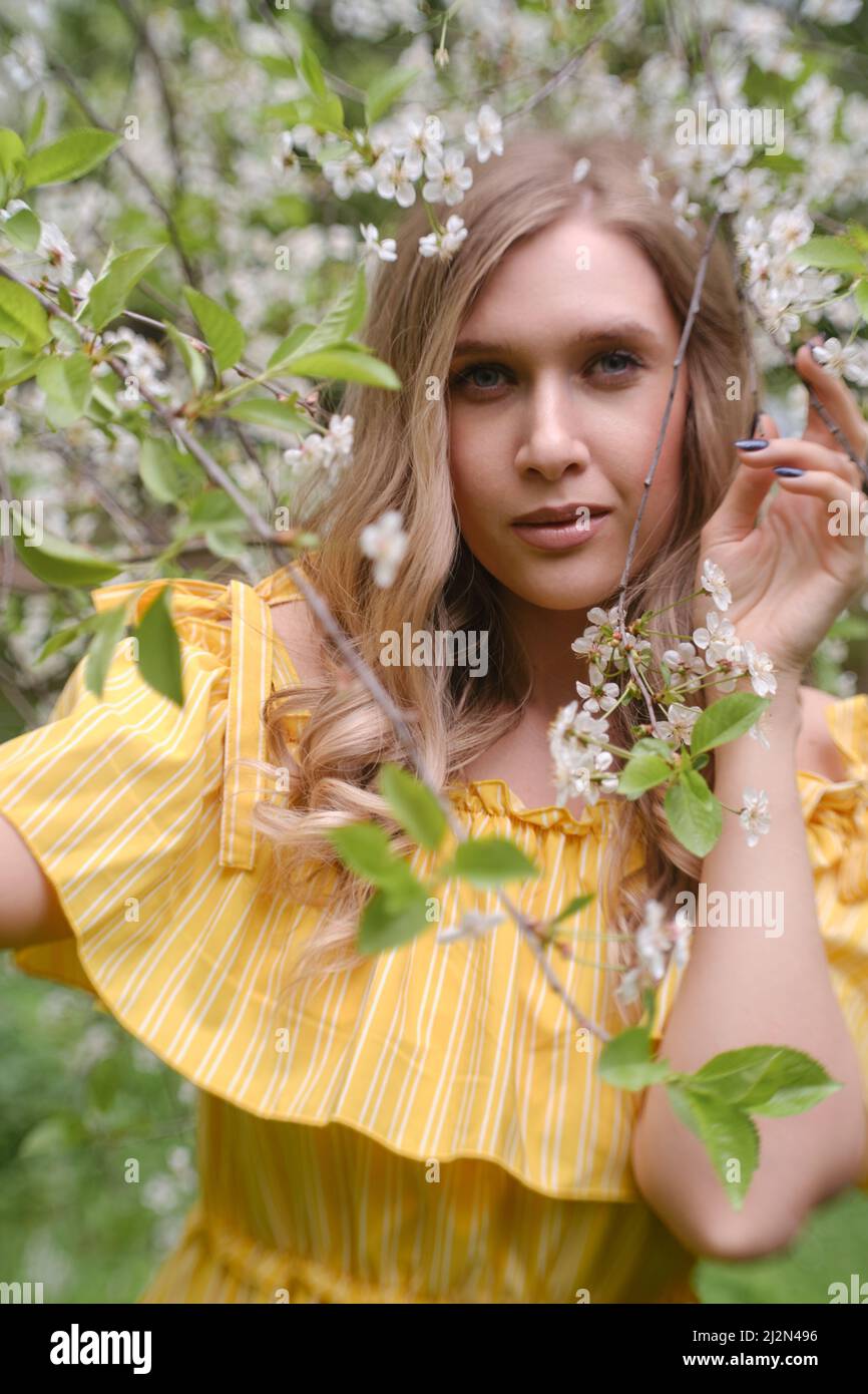 beautiful blonde woman near cherry blossoms close up portrait Stock ...