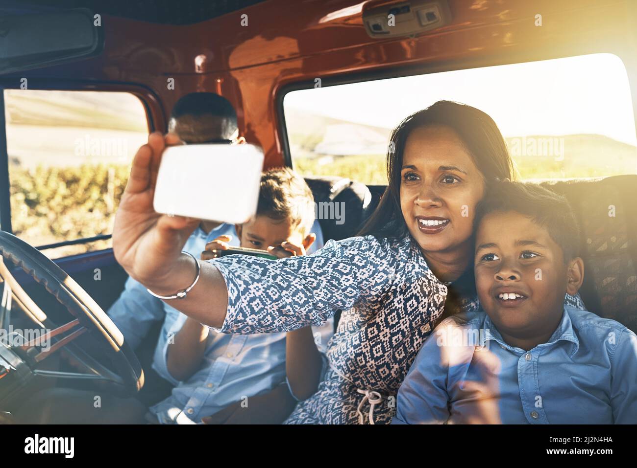 Time for some photos for the memories. Shot of a cheerful young family ...