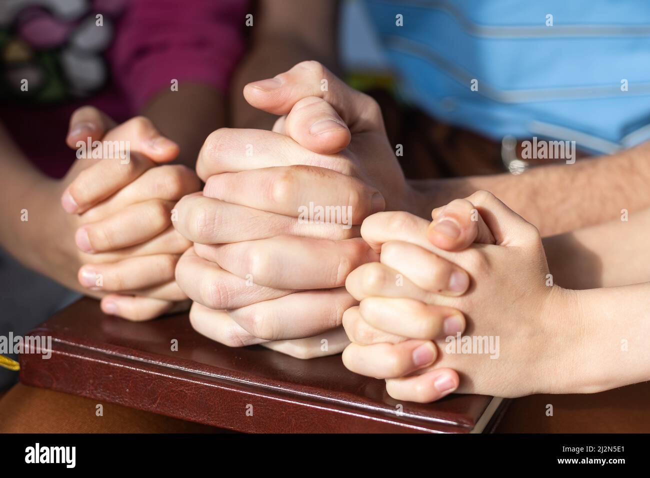 children praying with parent at home, family pray together, online ...