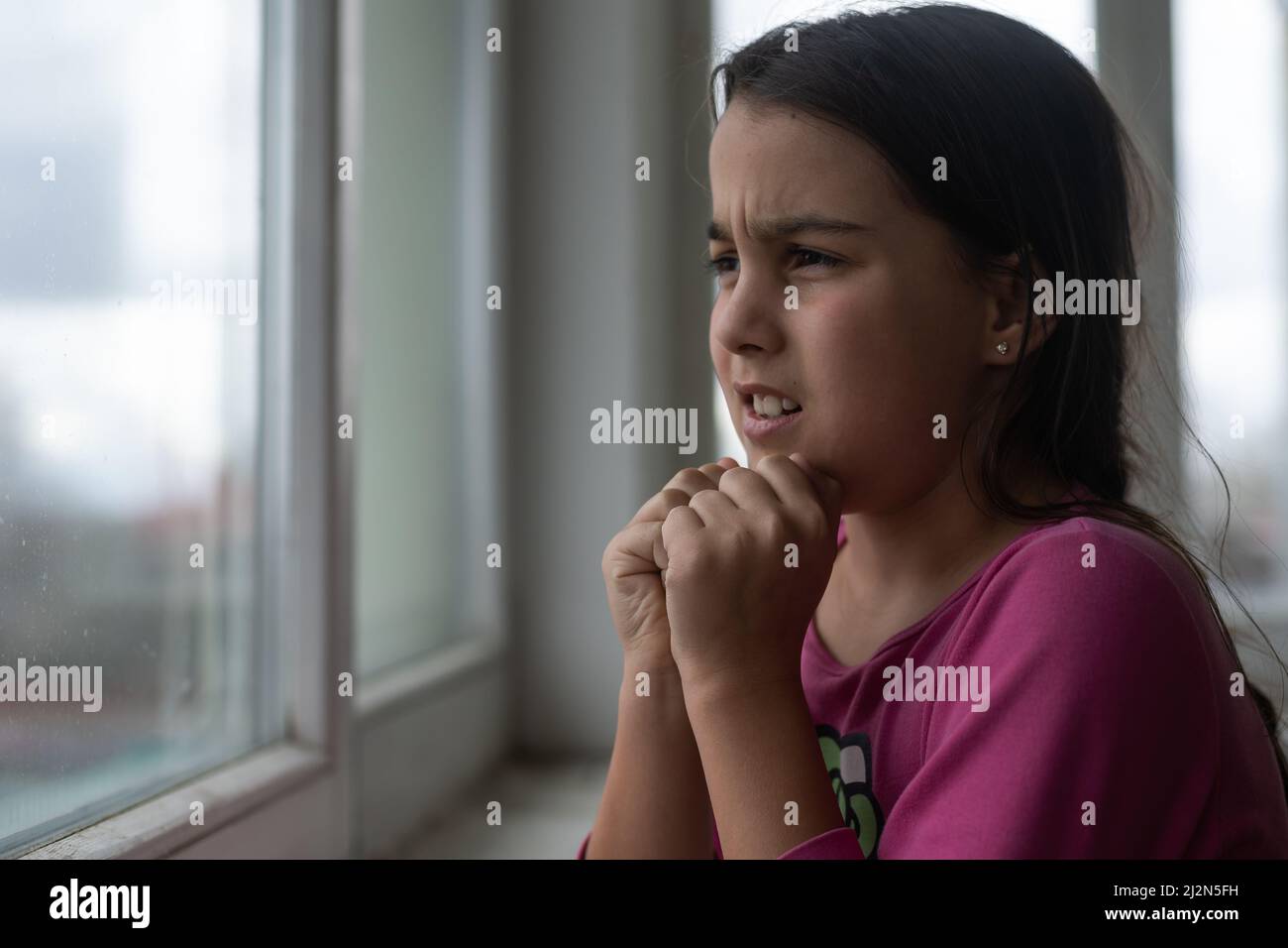 Little girl praying on the white table in the morning. Little girl hand ...