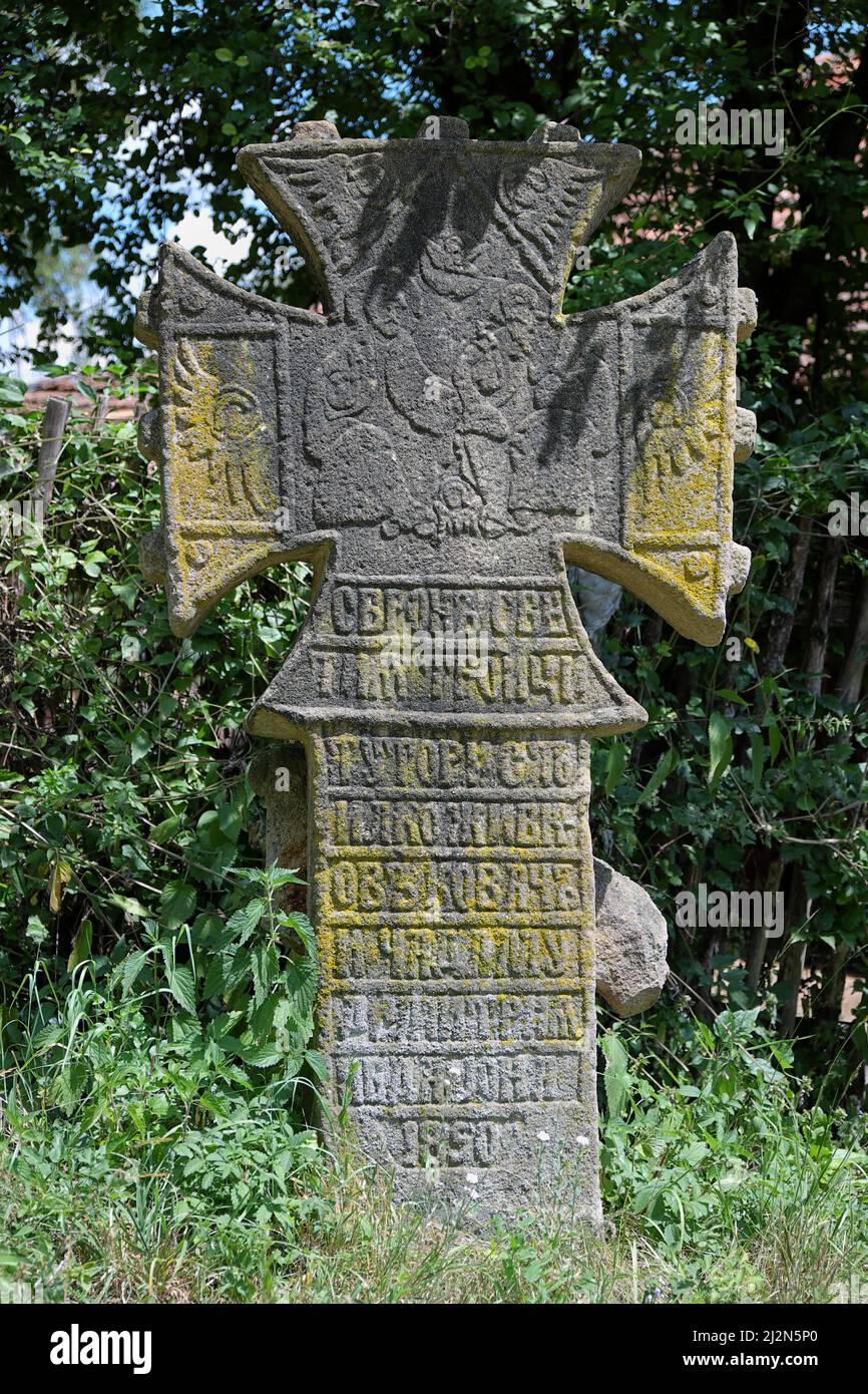 on a stone orthodox cross is carved christian nativity and Cyrillic ...