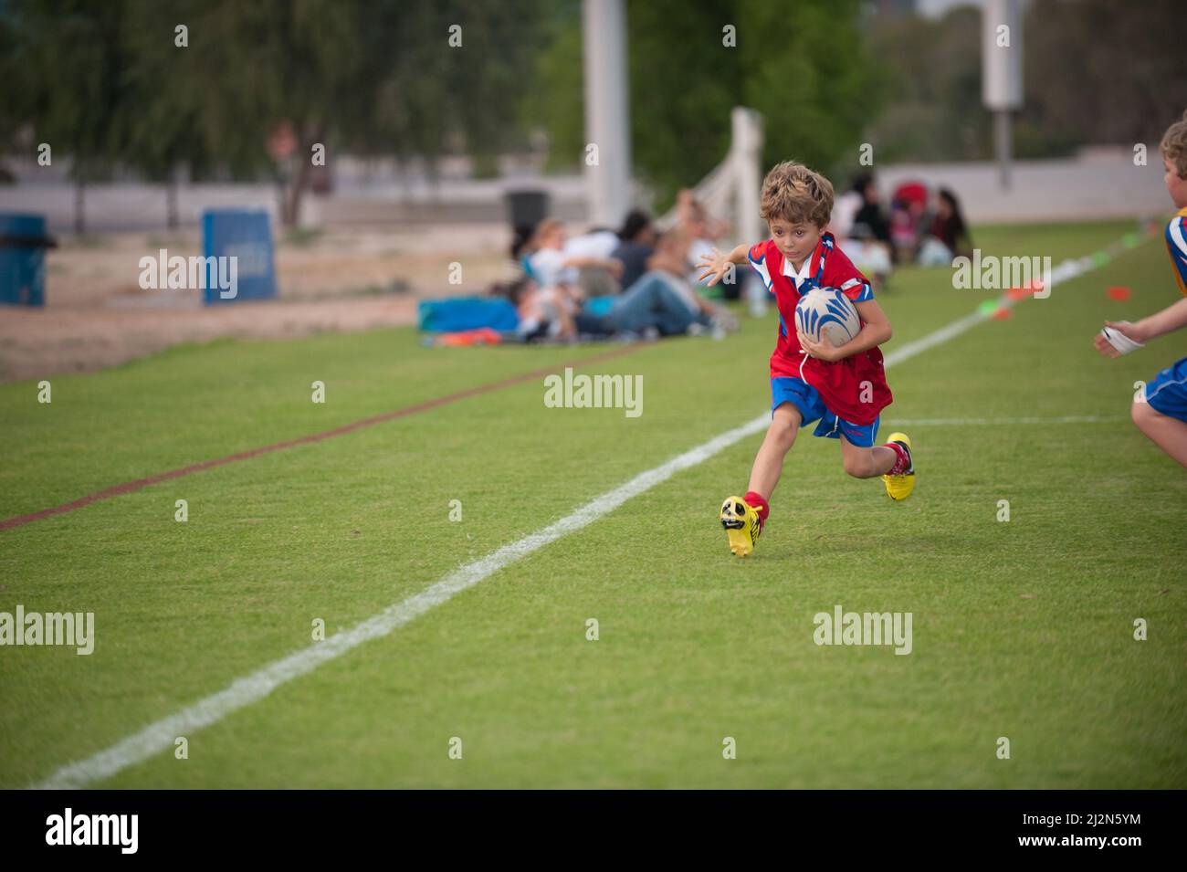 young kids playing rugby Stock Photo - Alamy