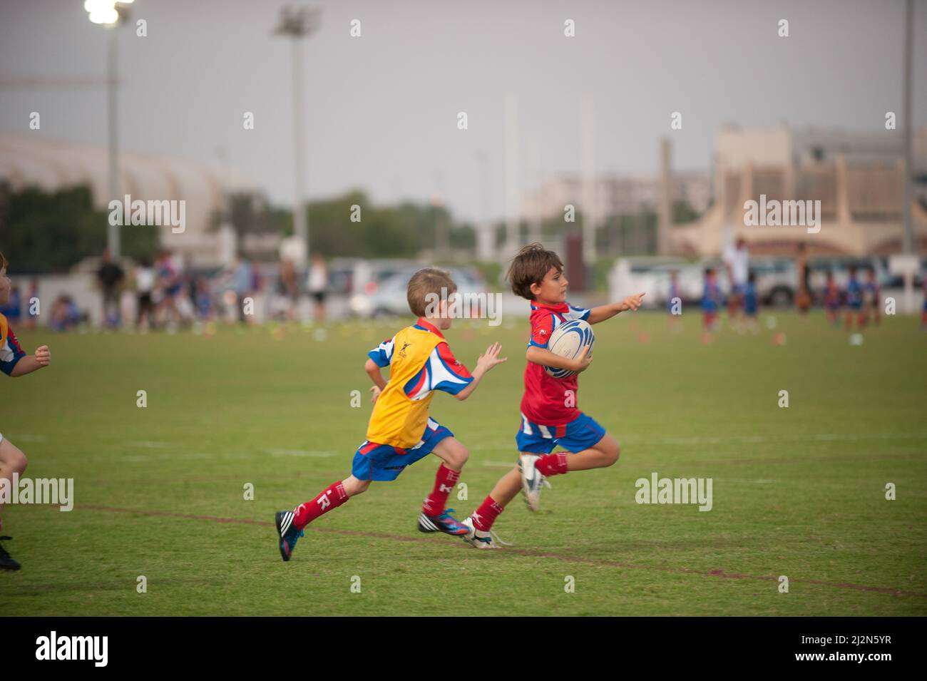 young kids playing rugby Stock Photo - Alamy