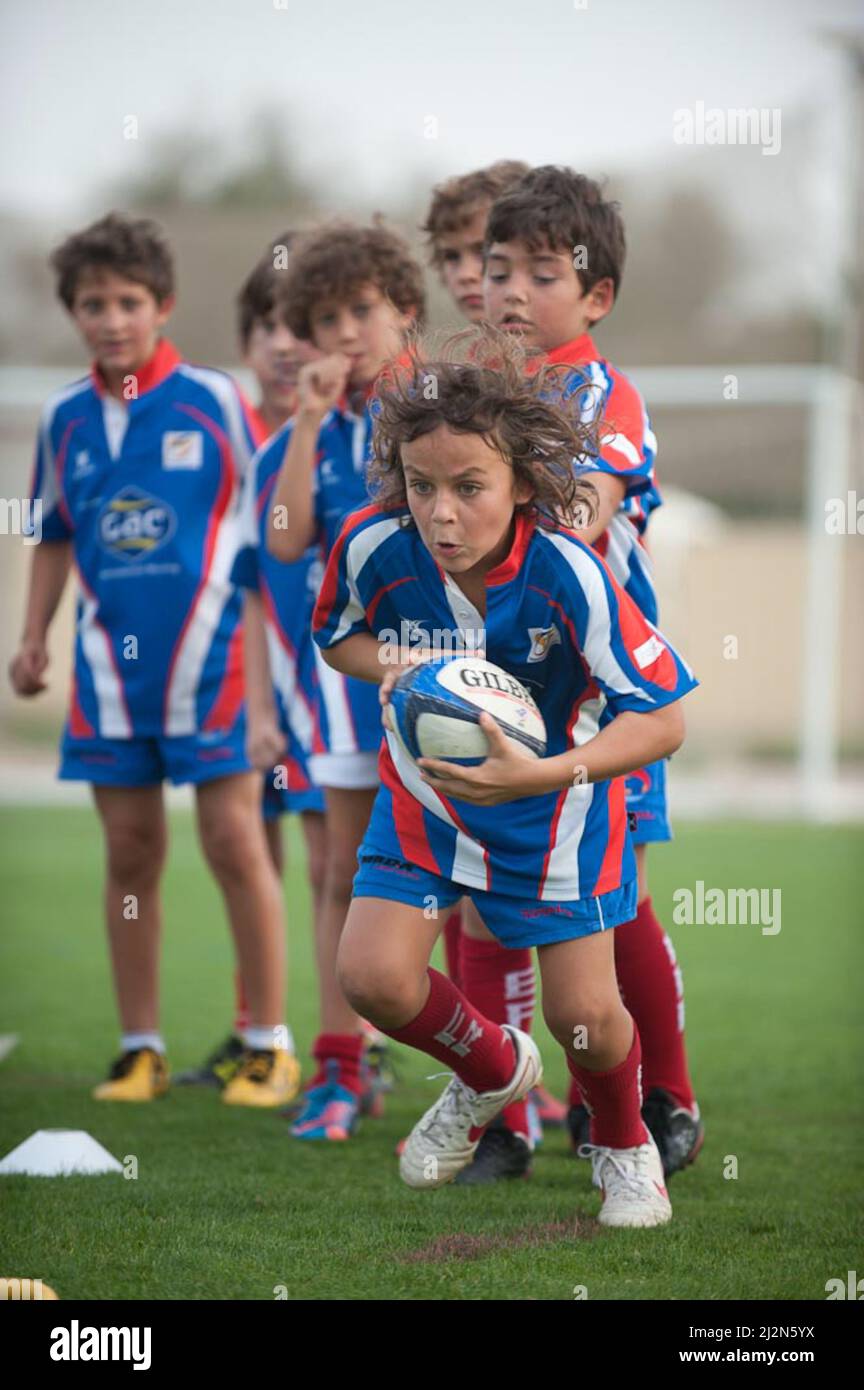 young kids playing rugby Stock Photo - Alamy