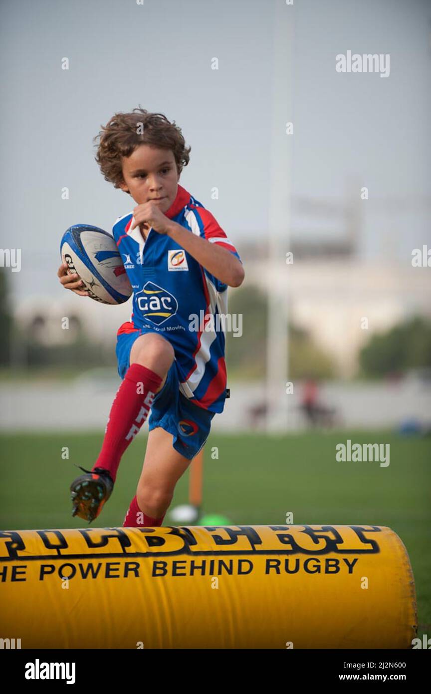 young kids playing rugby Stock Photo - Alamy
