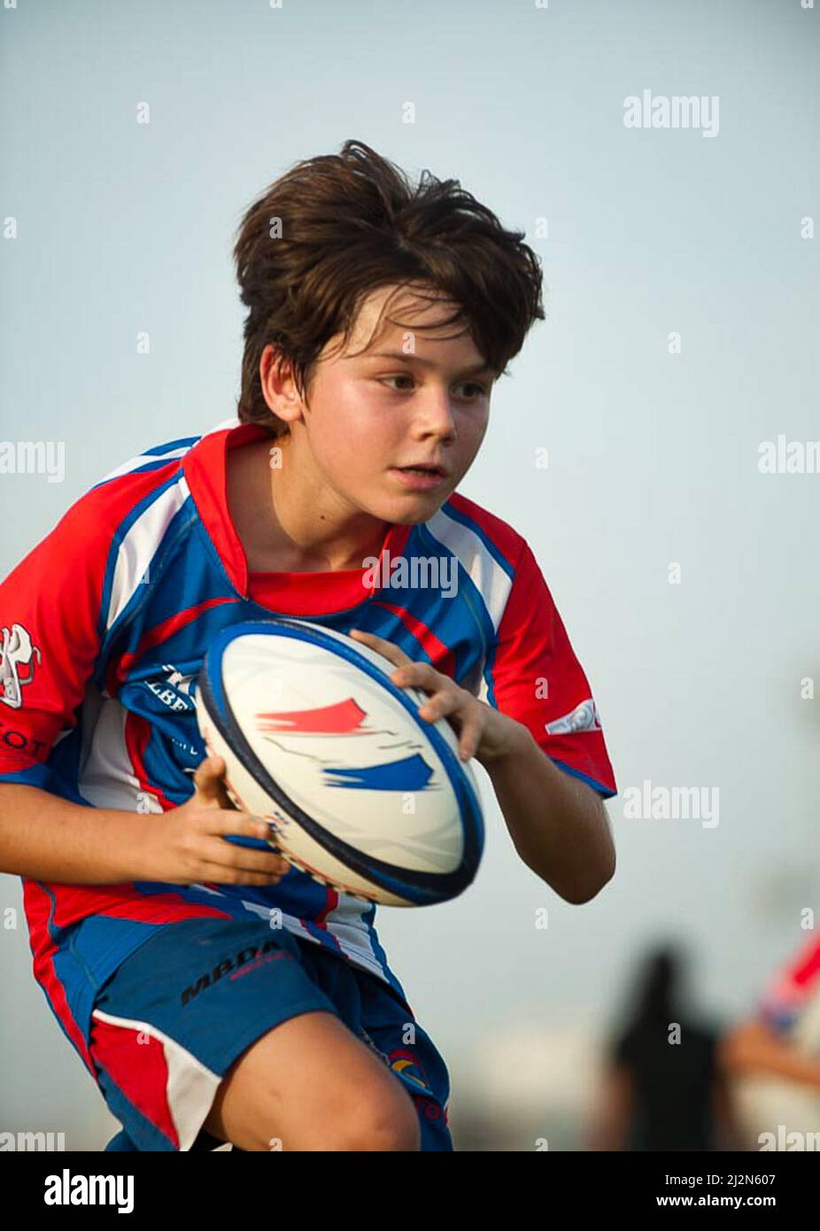 young kids playing rugby Stock Photo - Alamy
