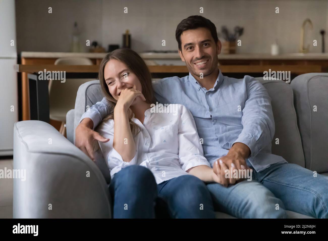 Happy attractive young couple home head shot portrait Stock Photo - Alamy