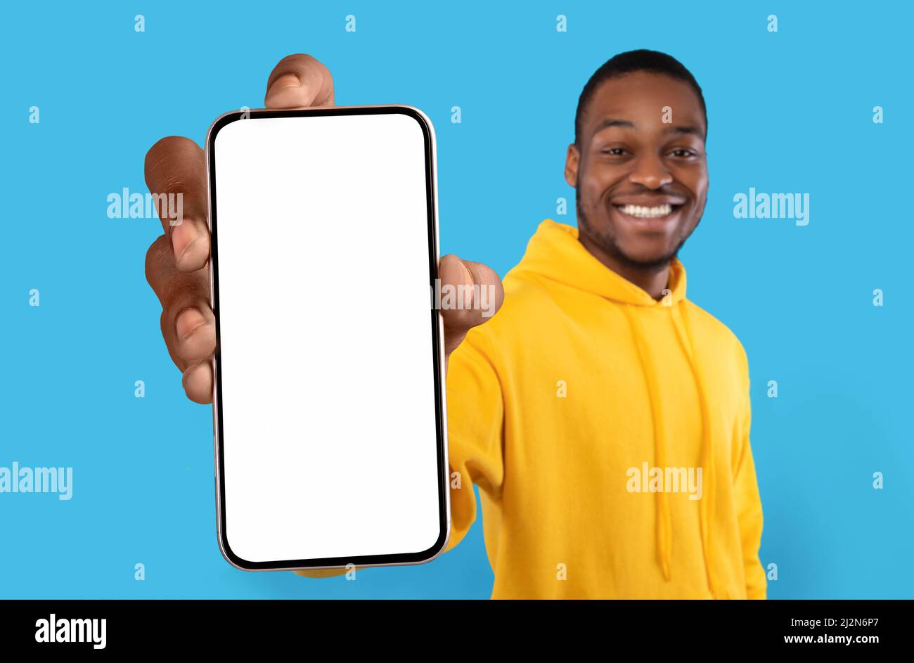 Mobile Ad. Joyful Black Guy Showing Big Blank Smartphone With White ...