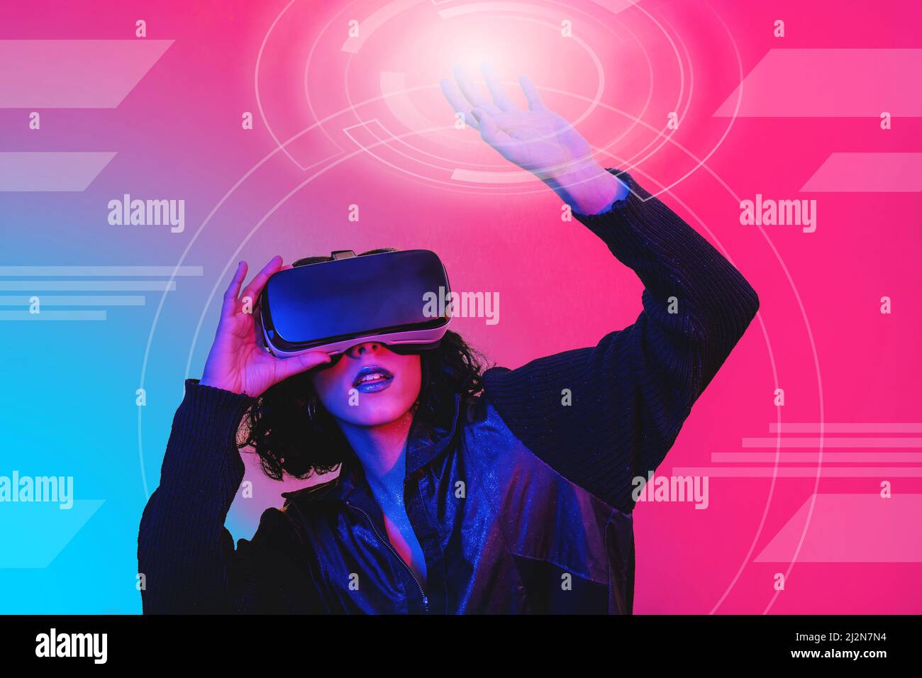 The young woman is using the virtual reality viewer. Portrait of modern ...