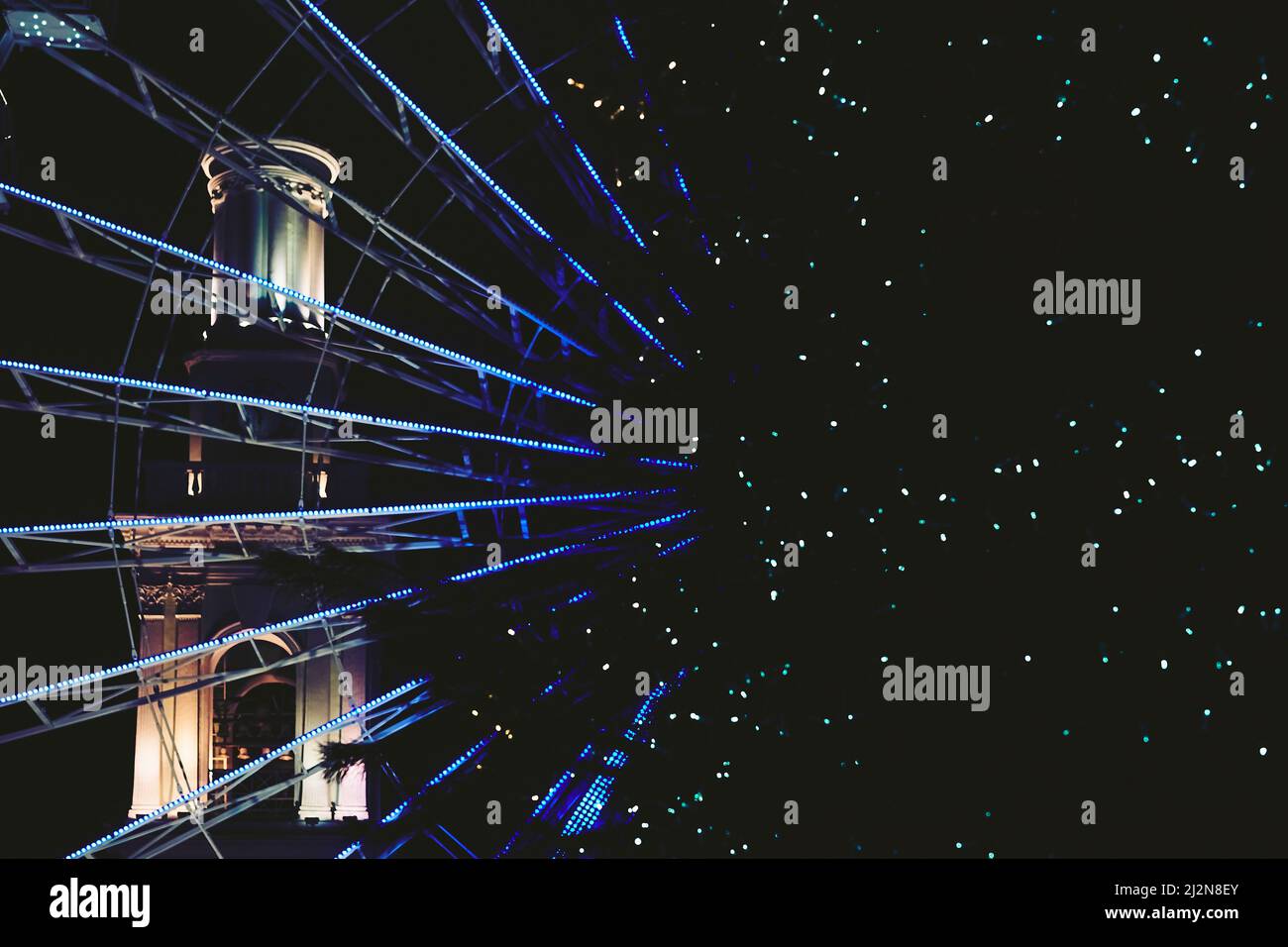 City bell tower, illuminated ferris wheel and starry sky Stock Photo ...