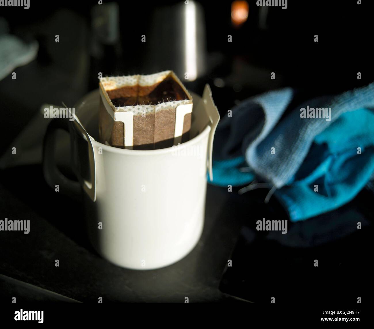 a bag of dripper coffee in a mug, indoor closeup Stock Photo - Alamy